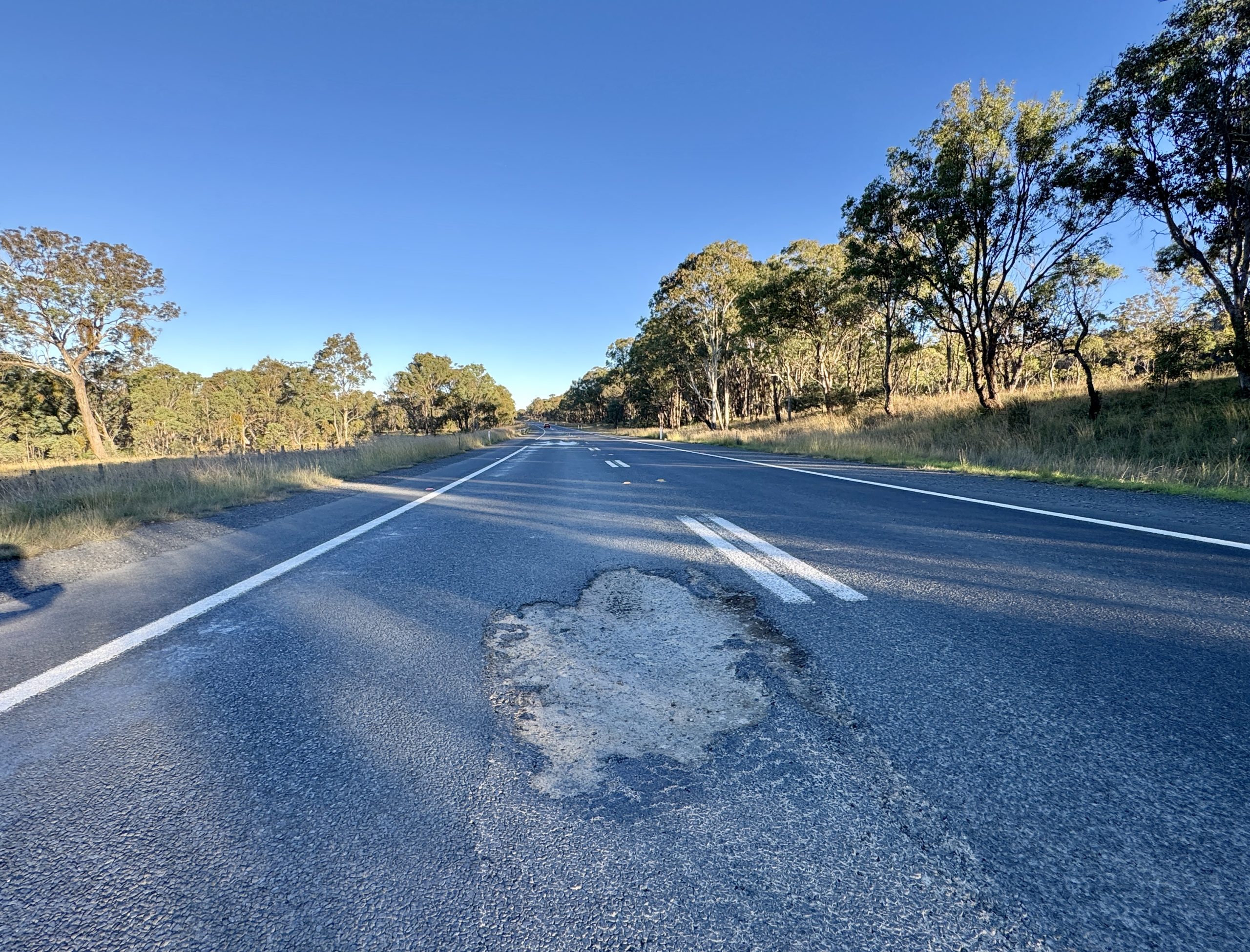 "Just trashed": New England Highway disintegrates under diverted trucks ...